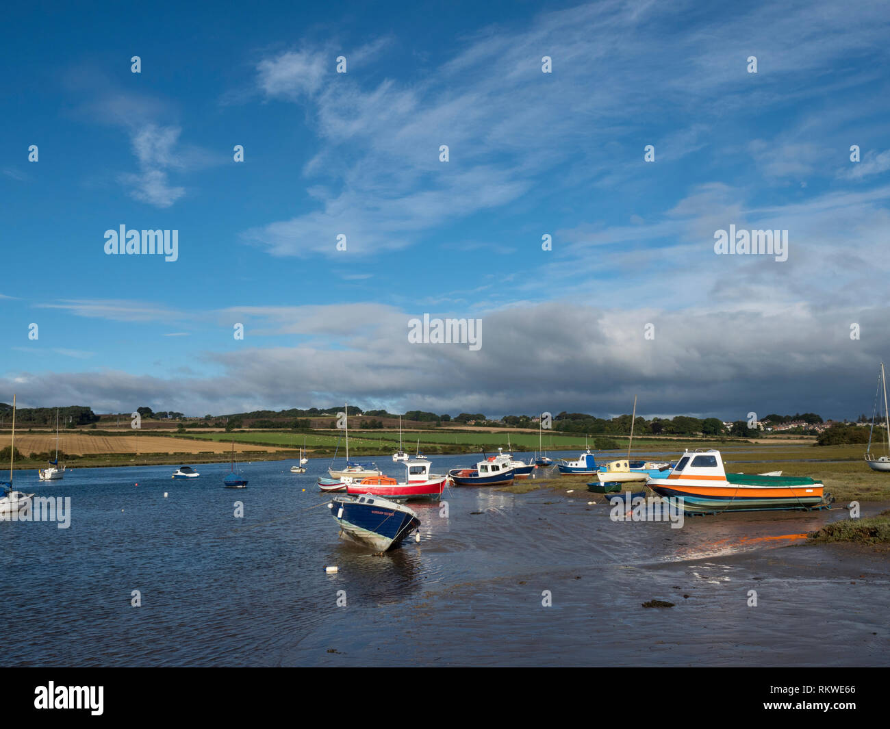 View of Alnmouth with boats on the tidal Aln Estuary Stock Photo - Alamy