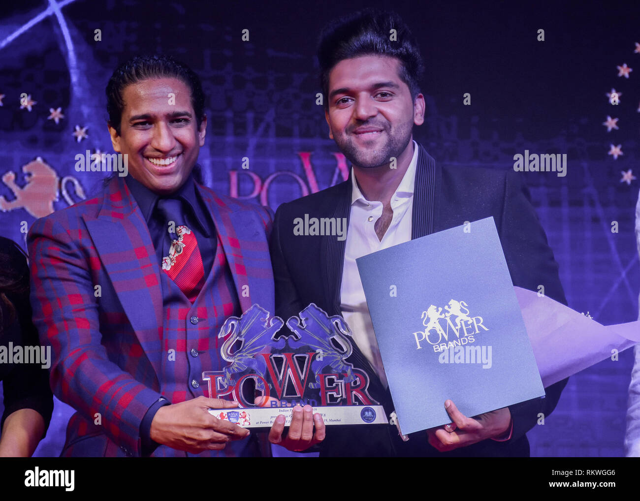 Indian singer Guru Randhawa (R) attends Power Brands-Bollywood Film ...