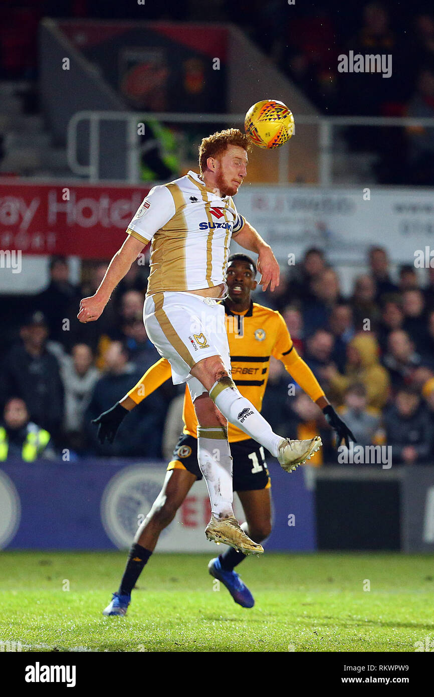 Newport, UK. 12th Feb, 2019. Dean Lewington of MK Dons clears during ...