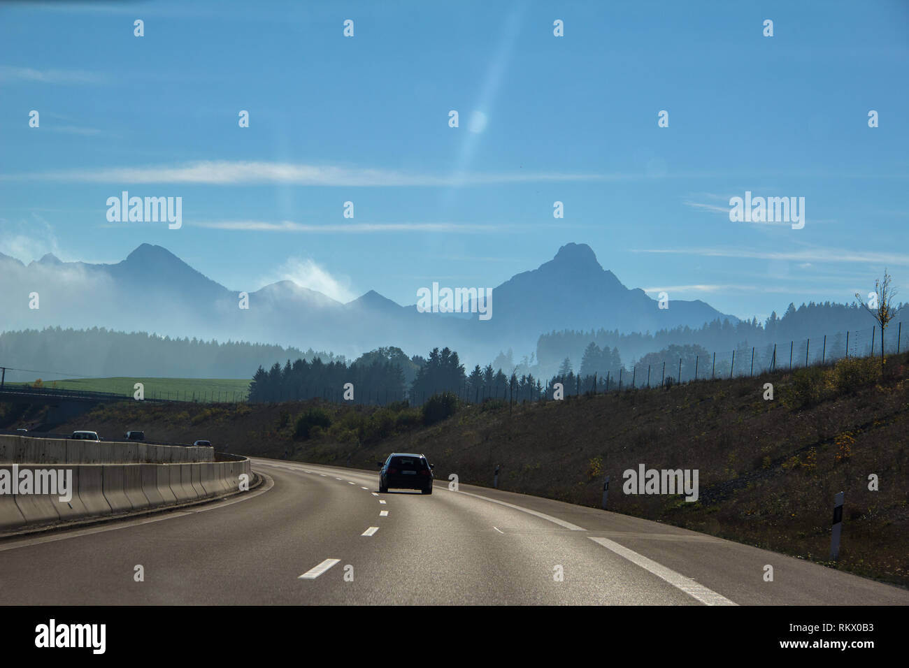 Highway / Single car on autobahn morning Stock Photo - Alamy