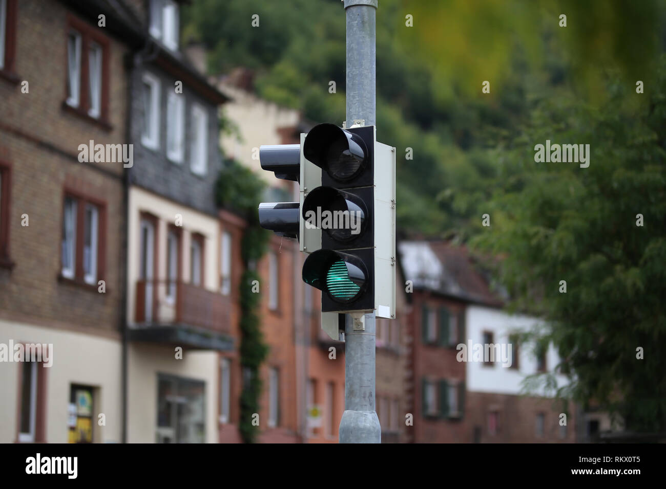 Green / Traffic light installed at the crossroads Stock Photo - Alamy