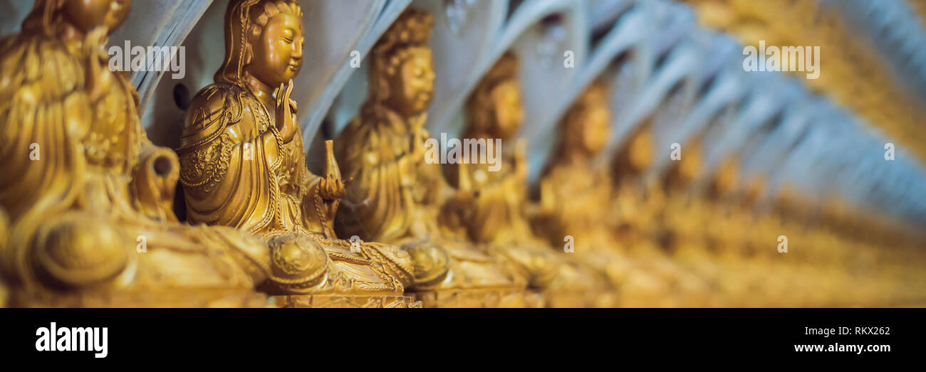 The wall in the temple is filled with buddhas. Religion Buddhism ...