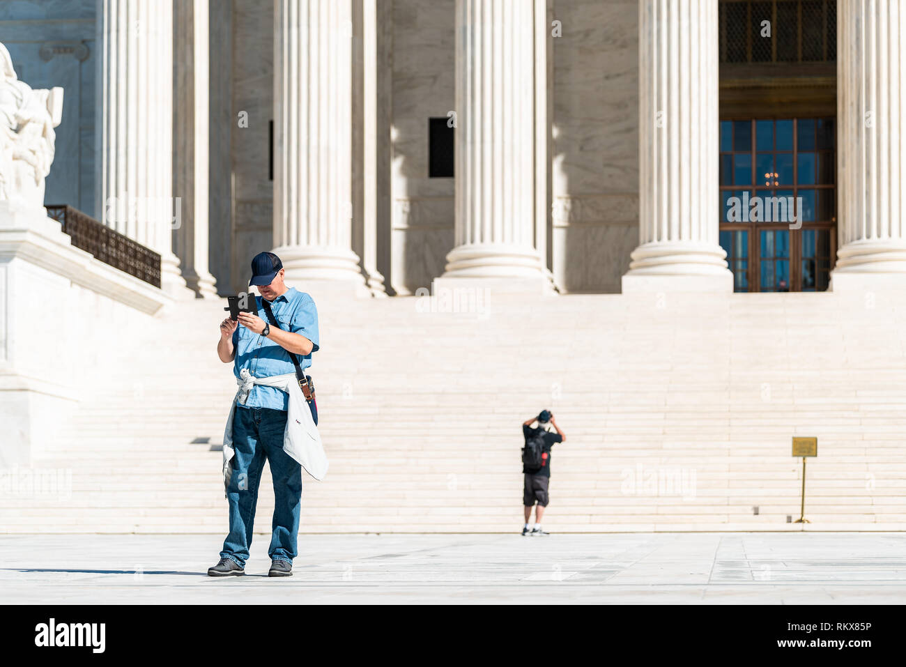 Man on marble stairs hi-res stock photography and images - Alamy