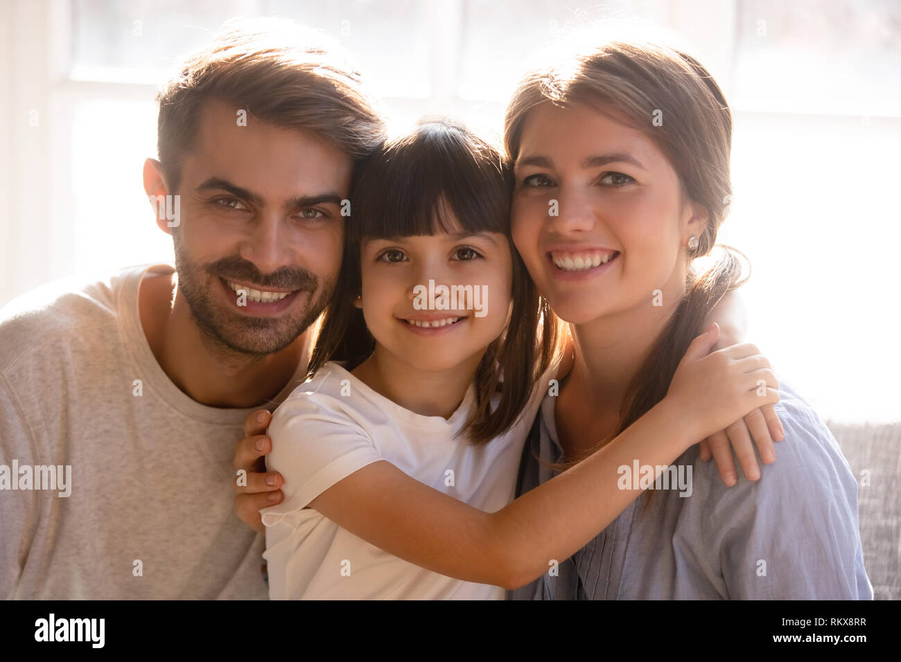 Happy mom dad and little daughter with smiling faces portrait Stock ...