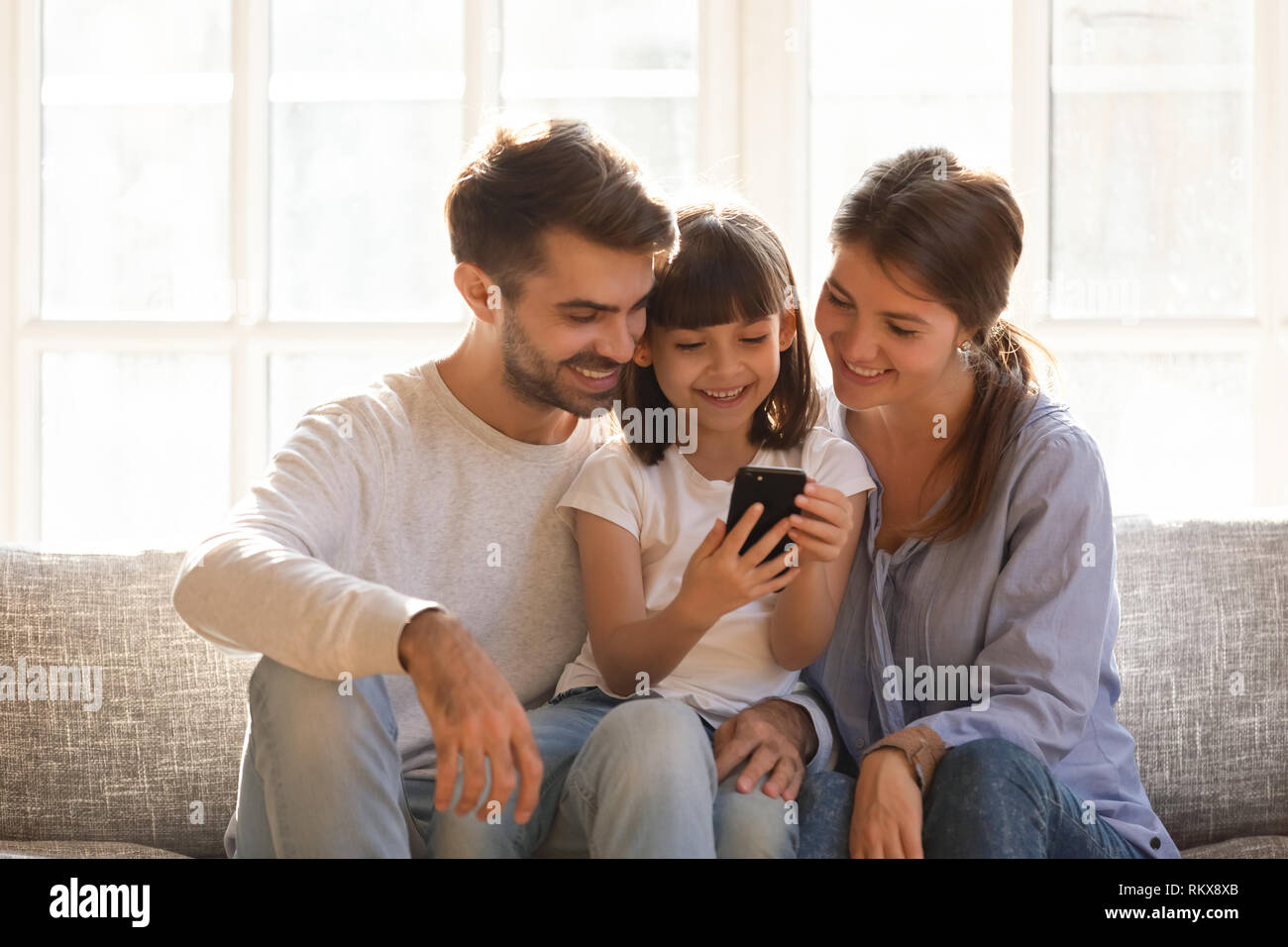 Parents cell child play hi-res stock photography and images - Alamy
