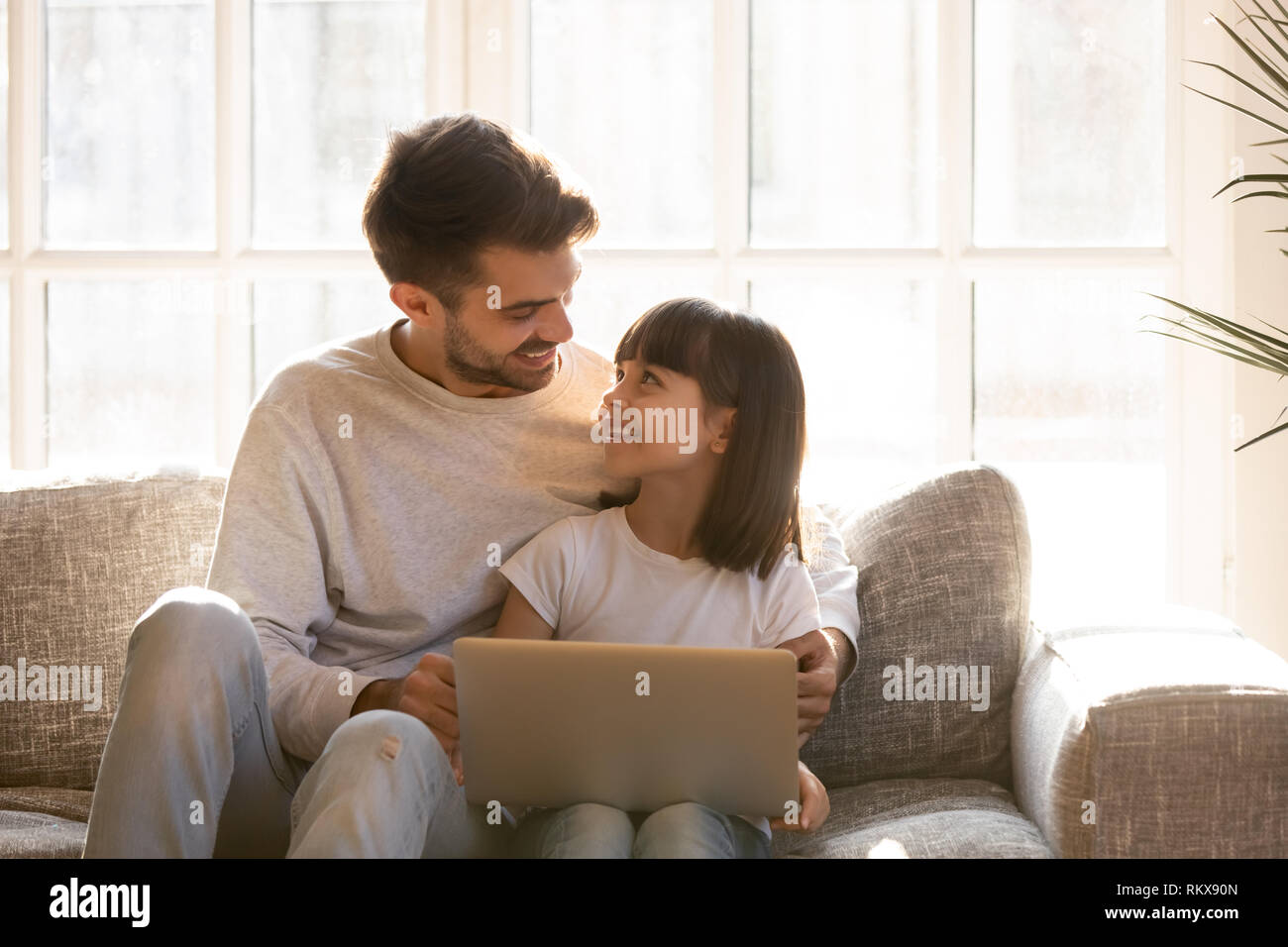 Happy dad and daughter having fun using laptop at home Stock Photo - Alamy