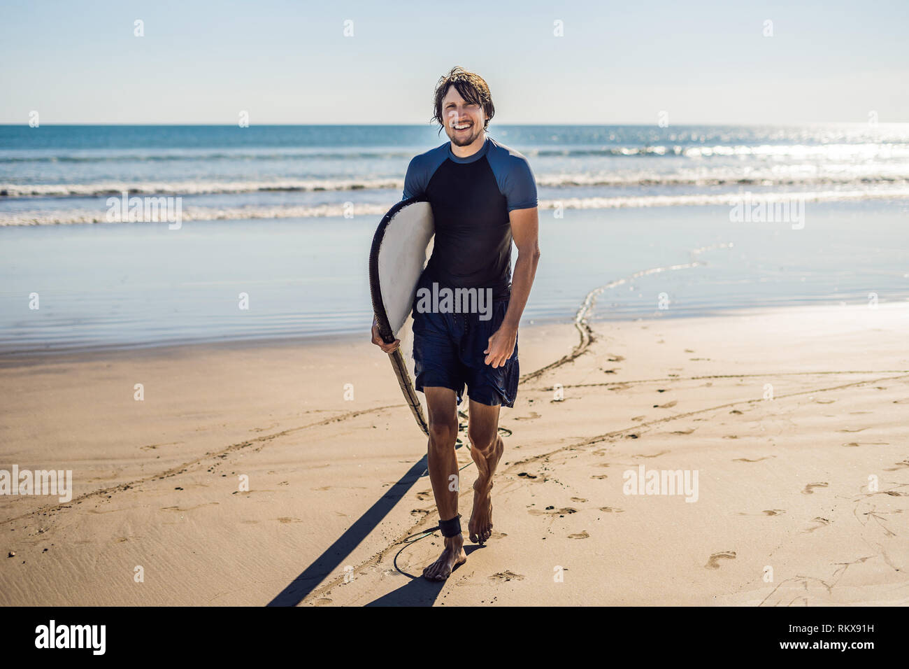 Handsome surfer posing surfboard hi-res stock photography and images ...