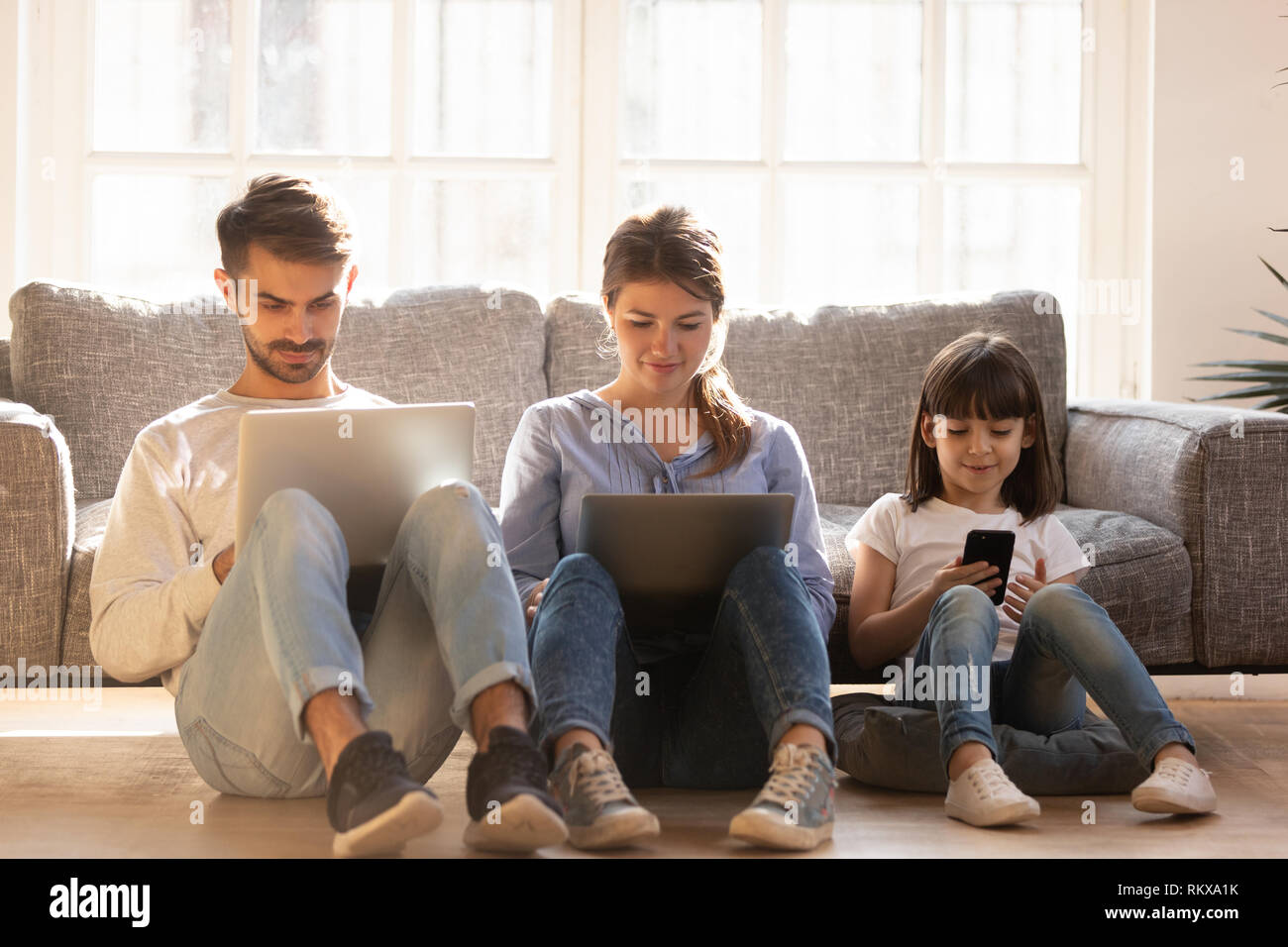 Family on devices watching hi-res stock photography and images - Alamy