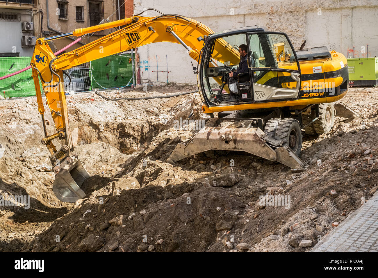 Malaga, Spain - March 23, 2018. Working Excavator Tractor Digging A ...
