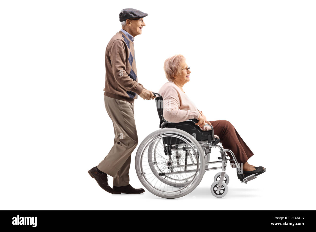 Person pushing wheelchair Cut Out Stock Images & Pictures - Alamy