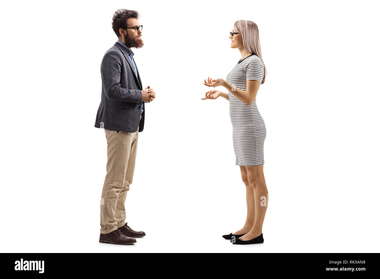 Full length profile shot of a man and woman standing and talking ...