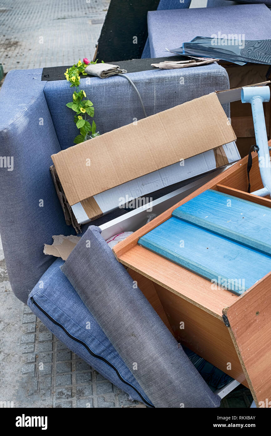 Home furniture thrown in the the street in the city polluting the town ...