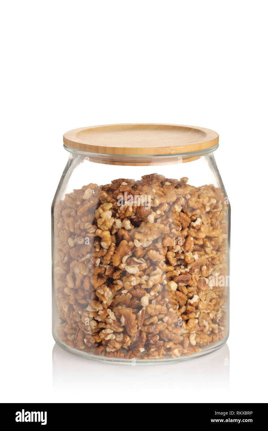A glass jar with walnuts isolated on white background Stock Photo - Alamy