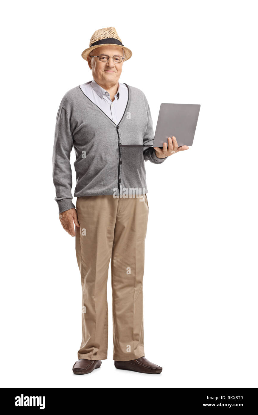 Full length portrait of a senior gentleman standing with a laptop ...