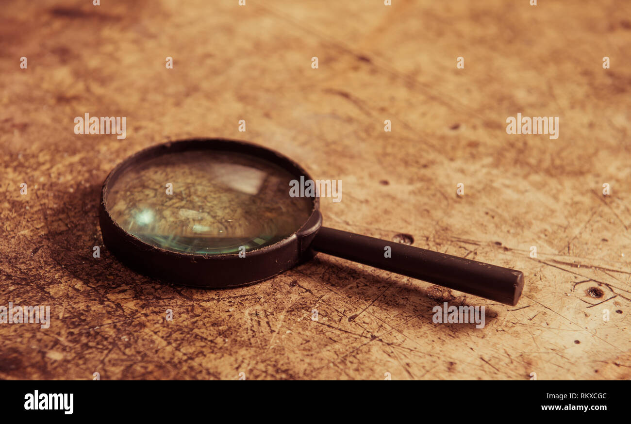 old dusty magnifier on scratched wooden vintage surface Stock Photo - Alamy