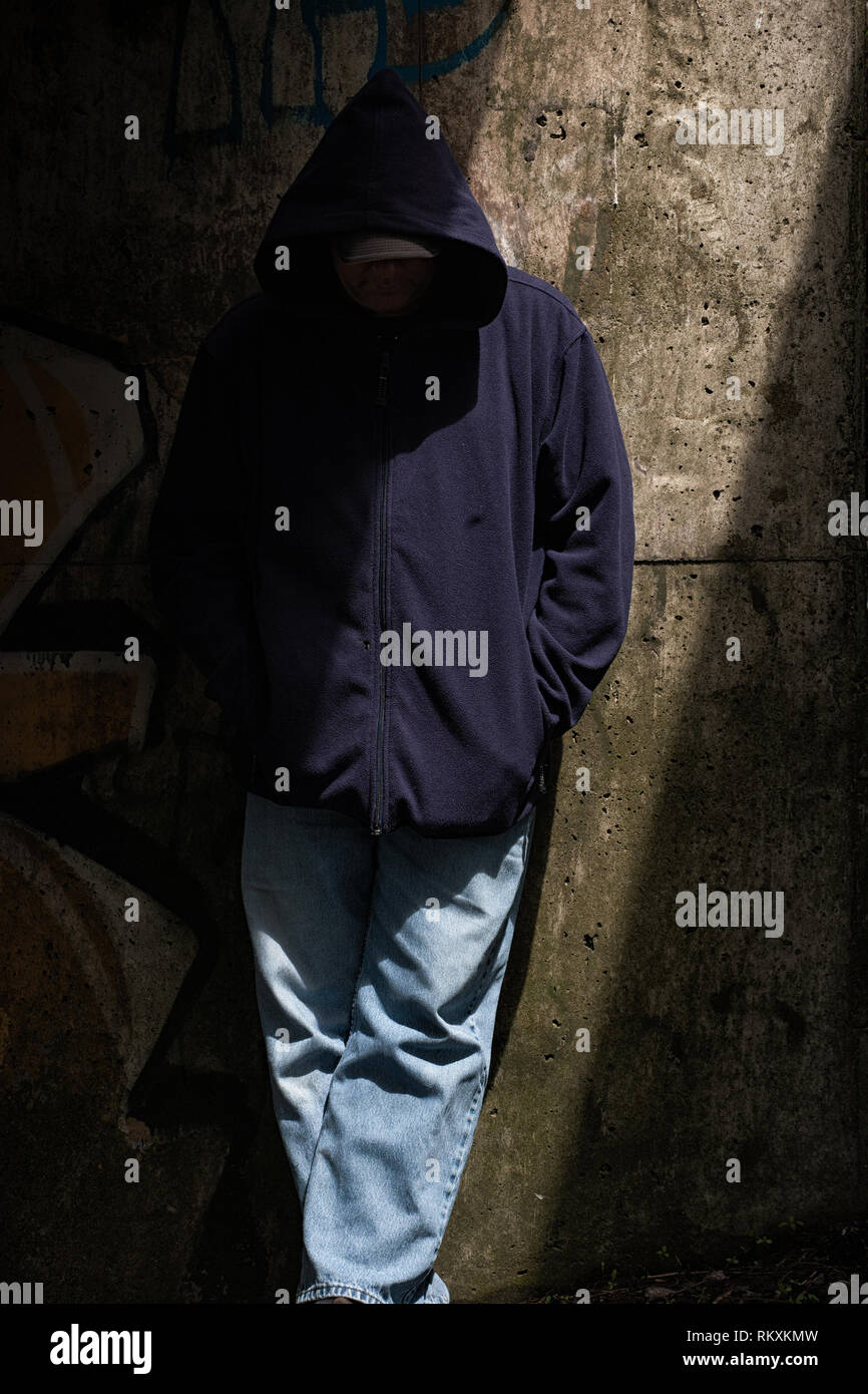 Homeless male in dark and rundown street location Stock Photo - Alamy