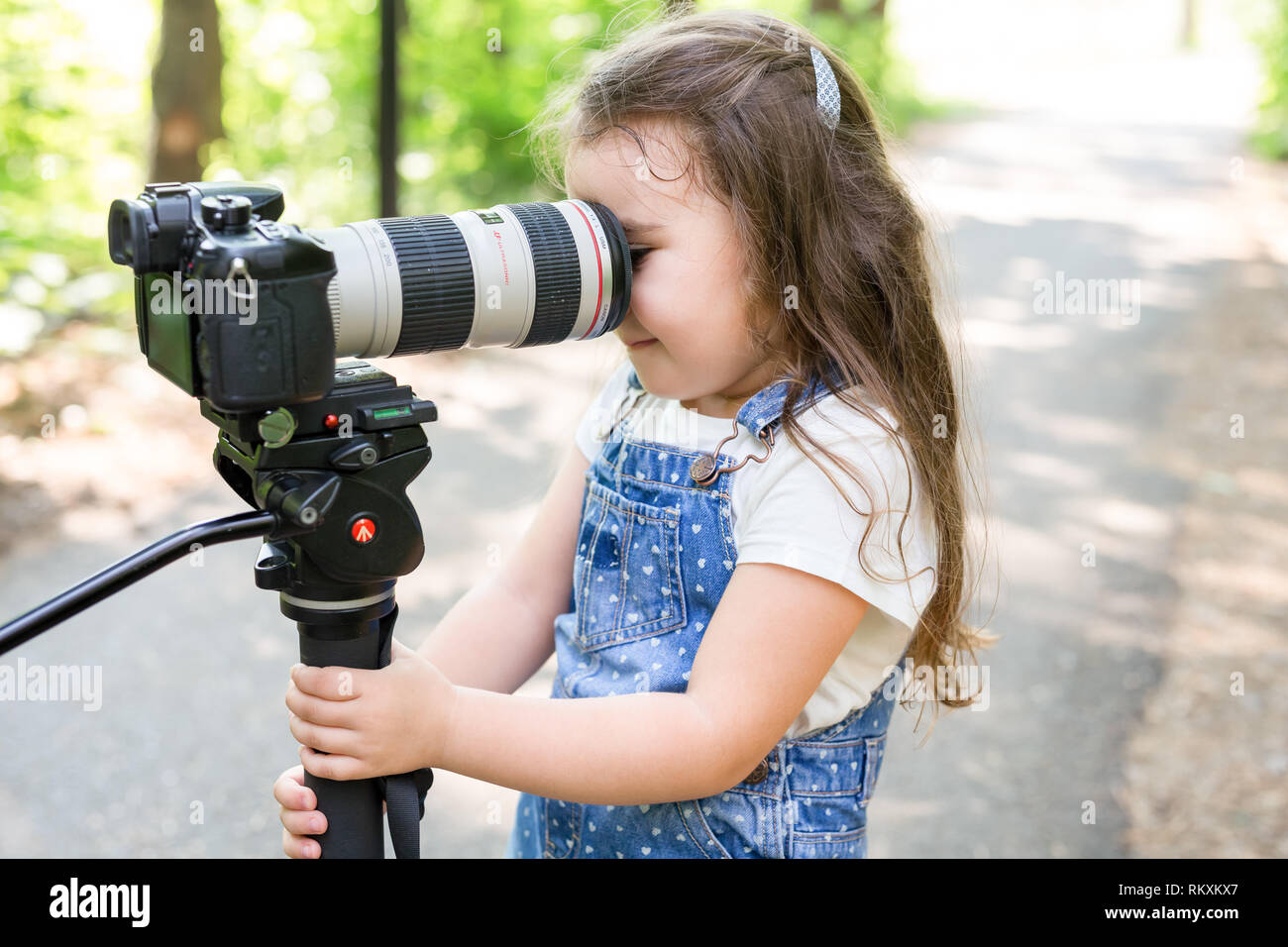 Hobby, profession, children and photographer concept - child with ...
