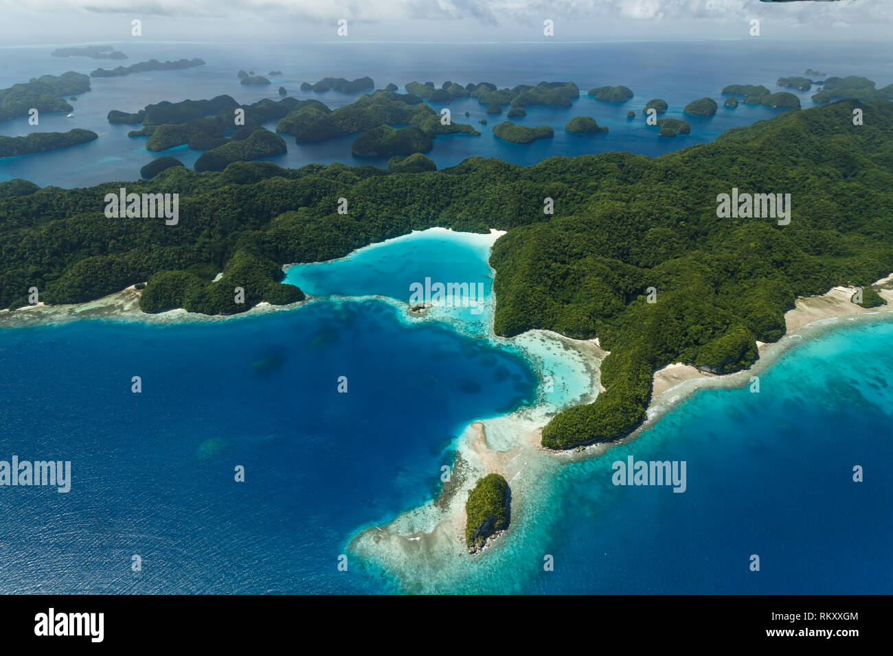 Colorful pattern of shore, reefs islands and ocean Stock Photo - Alamy