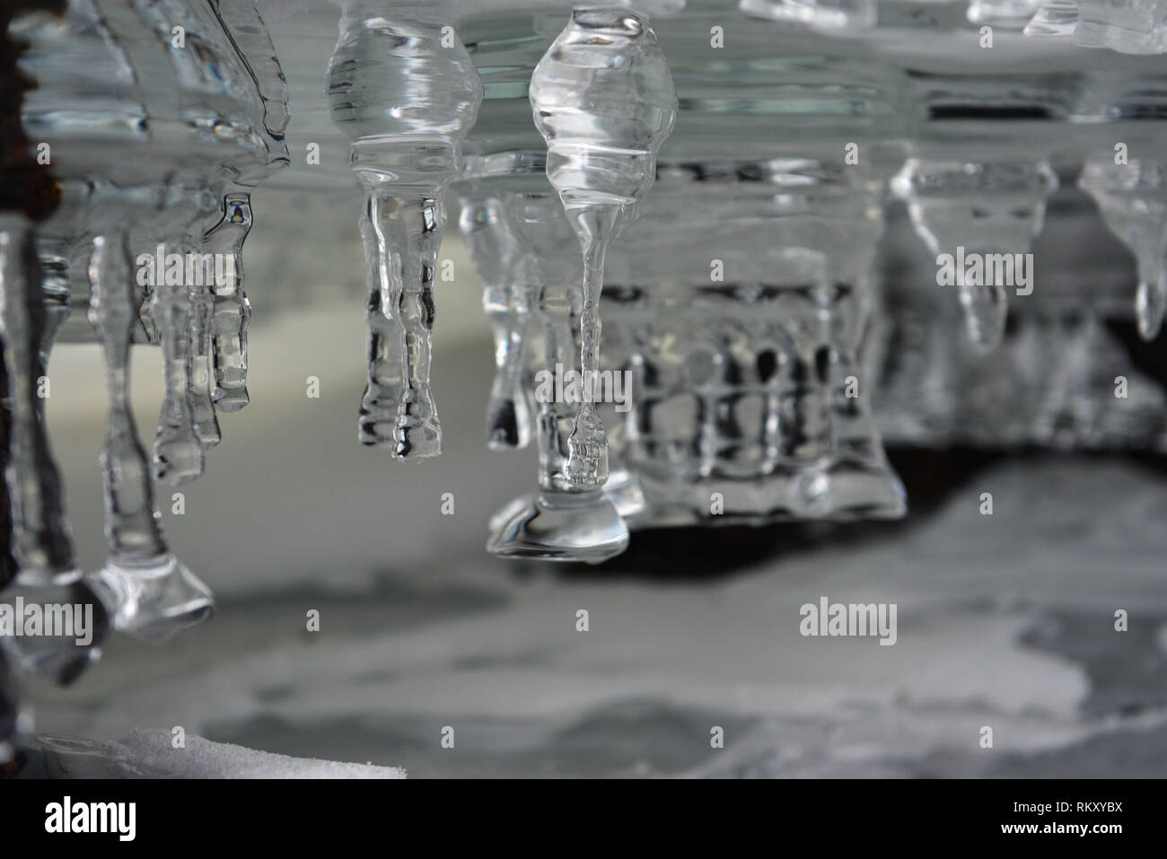 Spring melting of ice. Icicles gallery Stock Photo - Alamy