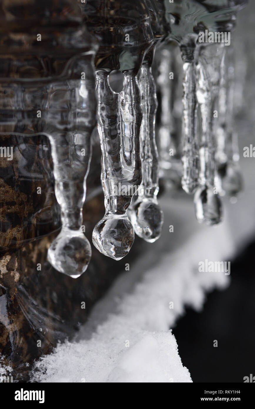 Spring melting of ice. Icicles gallery Stock Photo - Alamy