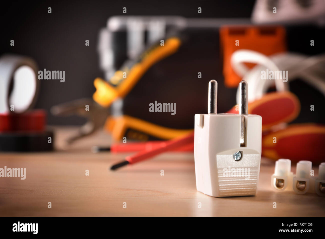 Concept of electricity works with plug and tools background. Horizontal ...