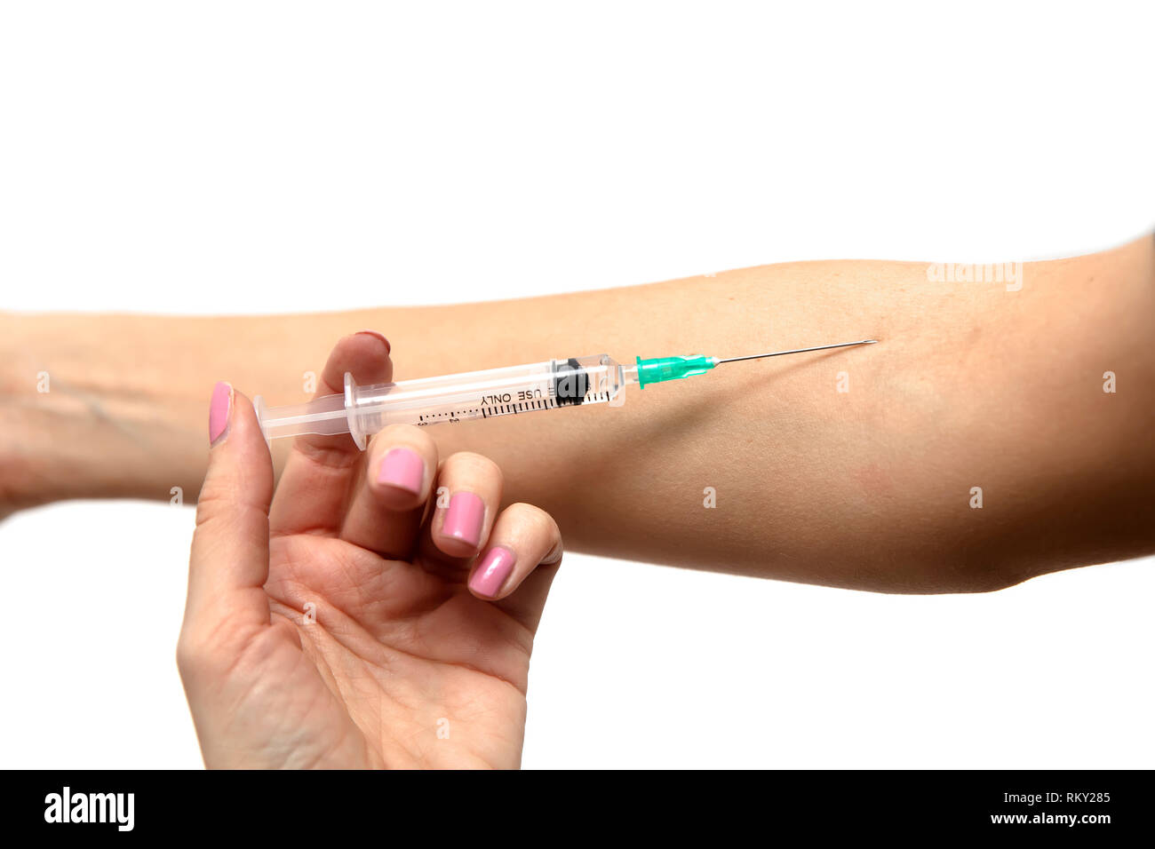 Woman gives her an injection in her hand against white background Stock ...