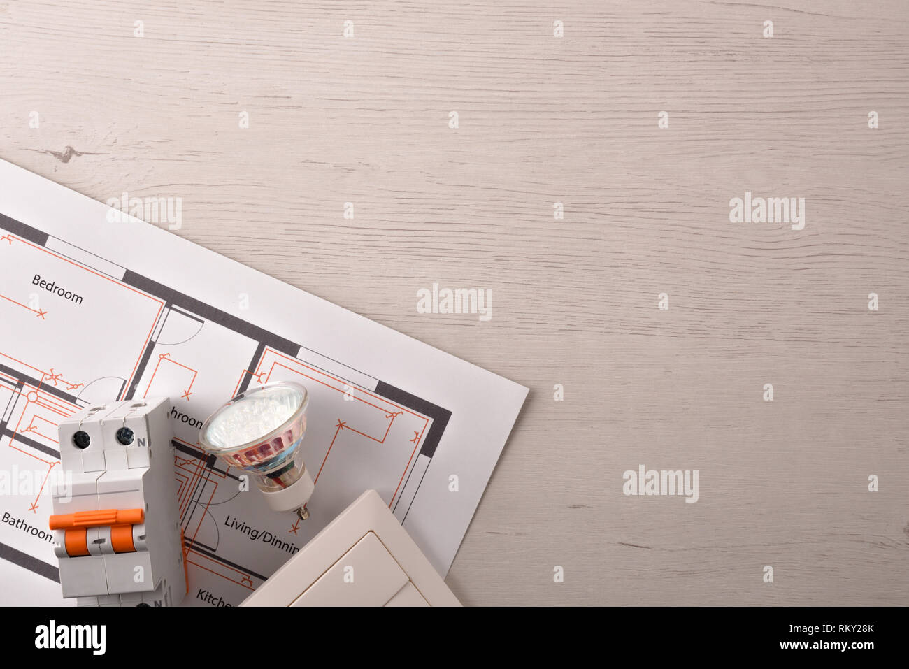 Equipment on white wooden table for electrical installation of housing ...