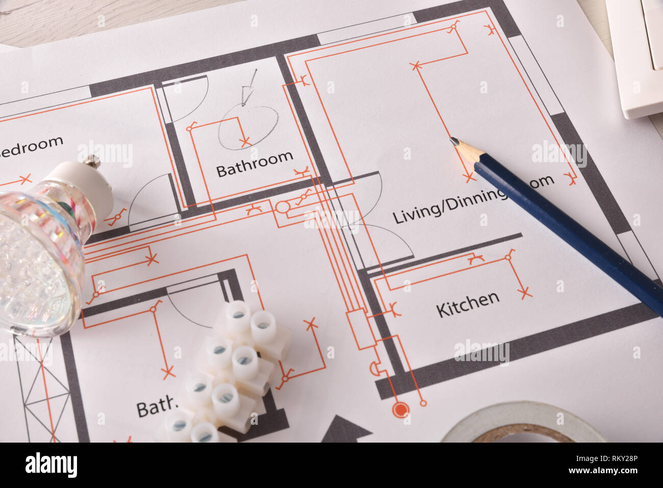 Equipment on white wooden table for electrical installation of housing ...