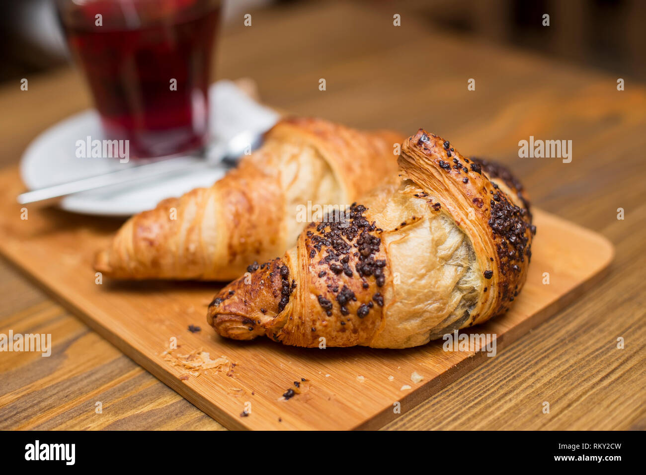Cup of tea and croissants served for breakfast Stock Photo - Alamy