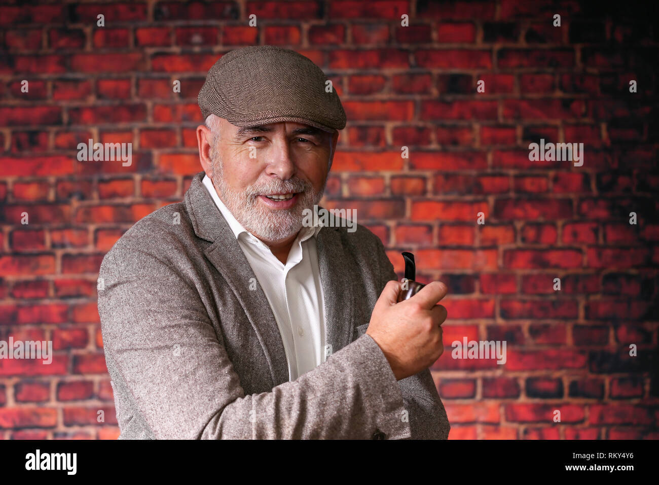 Portrait of a man with a pipe Stock Photo - Alamy