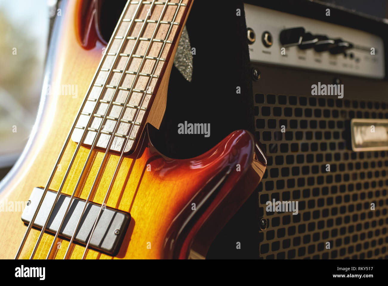 Playing Guitar. Close up view of brown electric guitar and amplifier ...