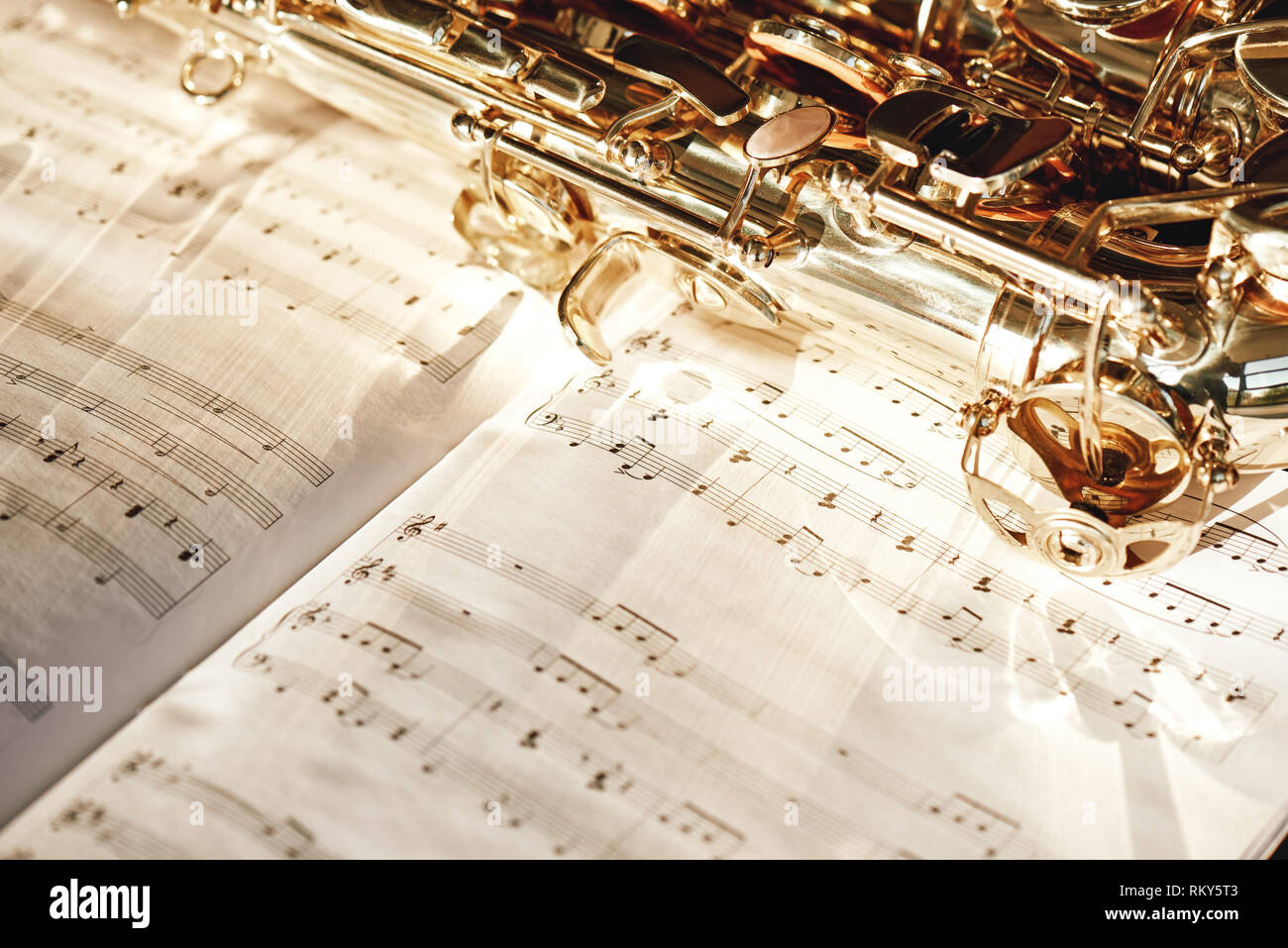 Time for jazz. Close up image of a shiny keys of golden saxophone lying ...