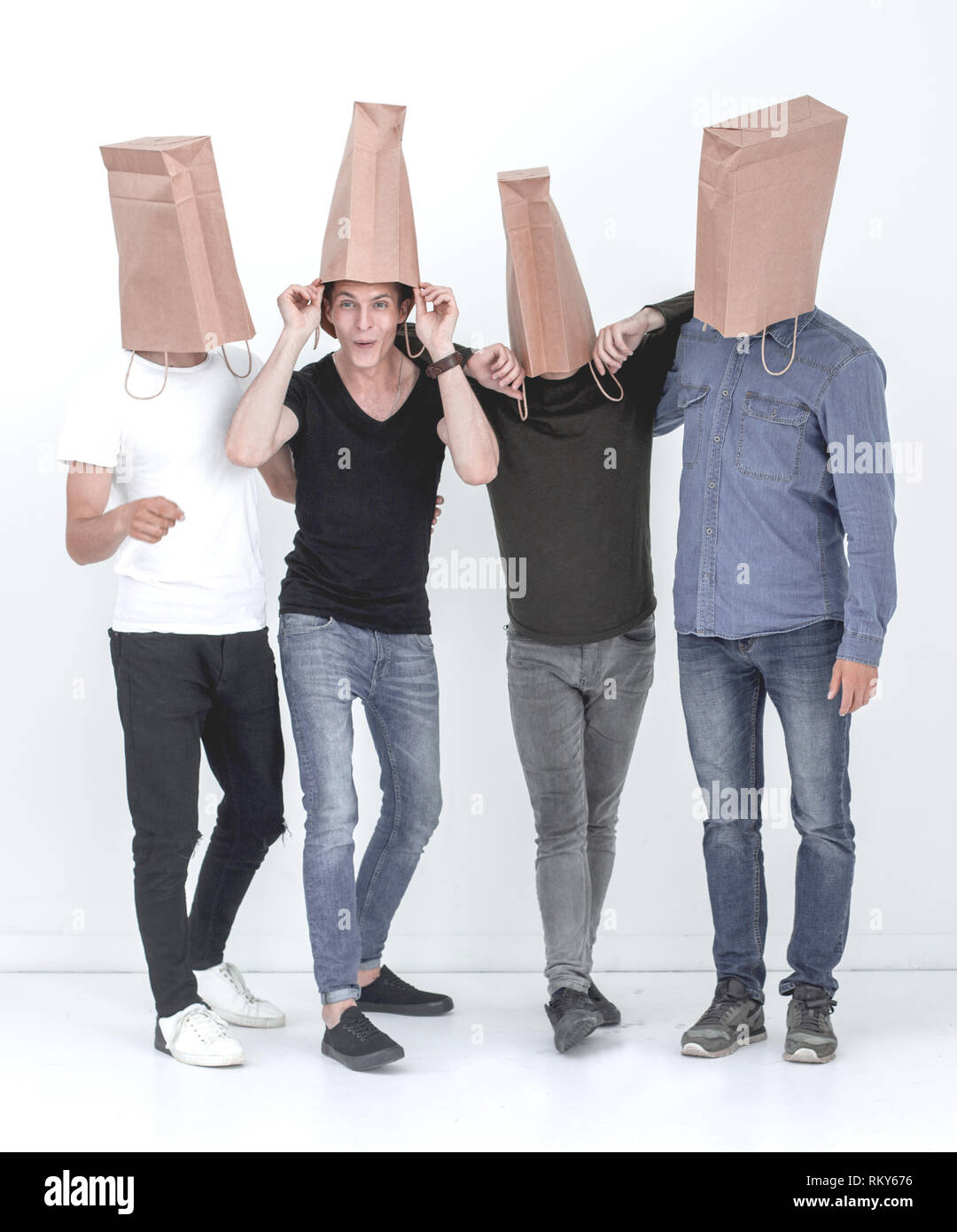 group of young people with paper bags on their heads Stock Photo - Alamy