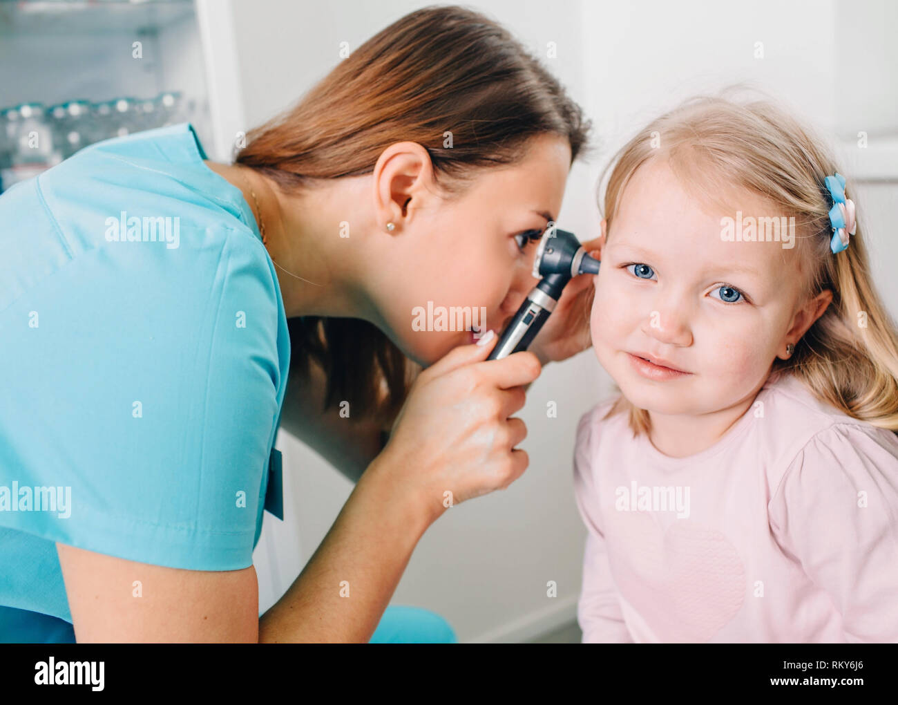 Cute little patient having ear exam with otoscope Stock Photo - Alamy