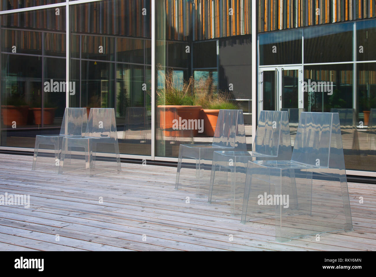 Row of Modern Translucent Chairs Stock Photo - Alamy