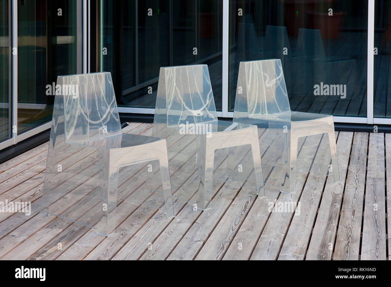 Row of Modern Translucent Chairs Stock Photo - Alamy