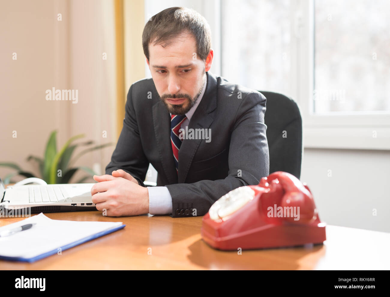 Business man waiting phone call Stock Photo - Alamy
