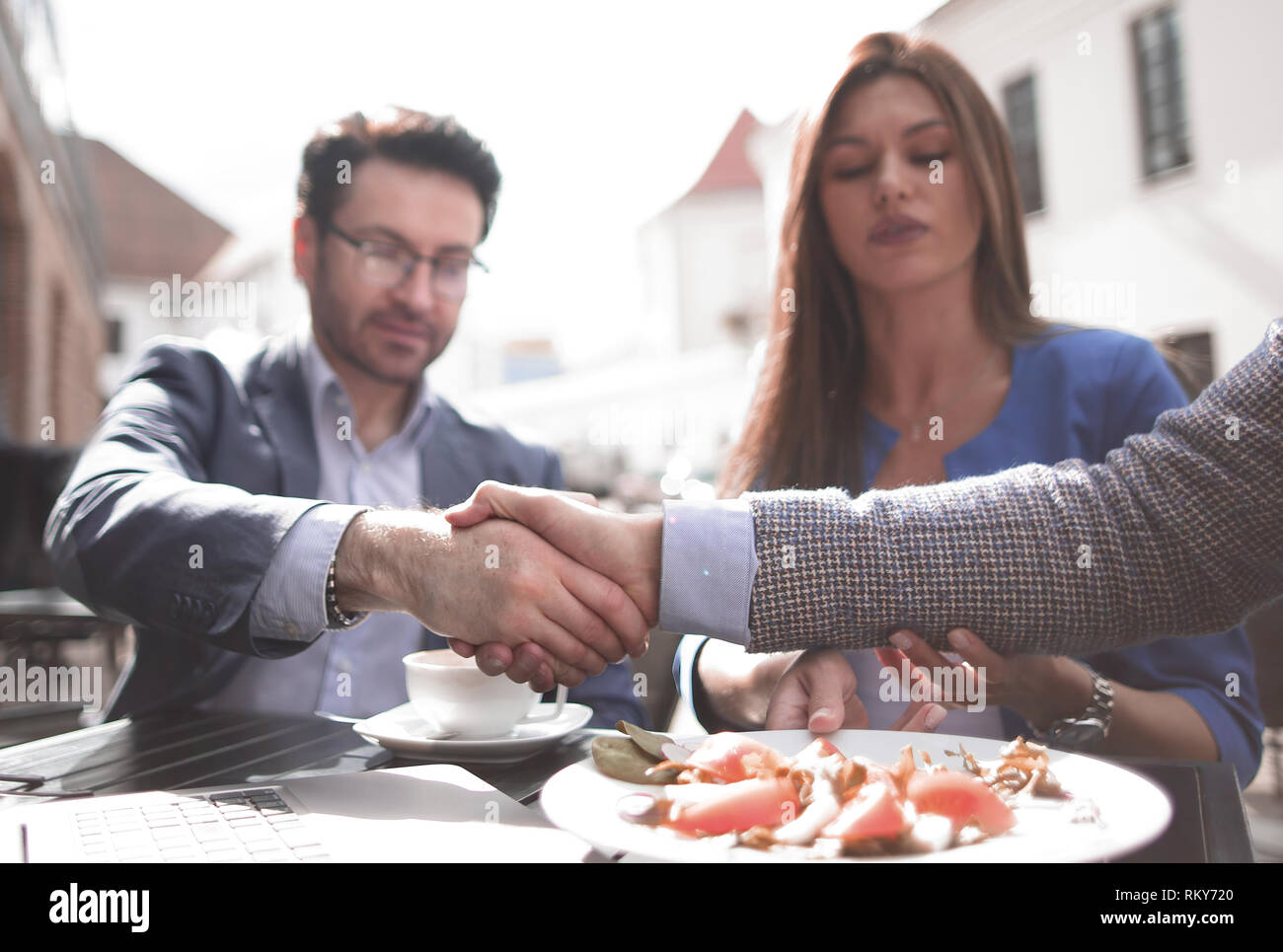 Women handshake restaurant hi-res stock photography and images - Alamy