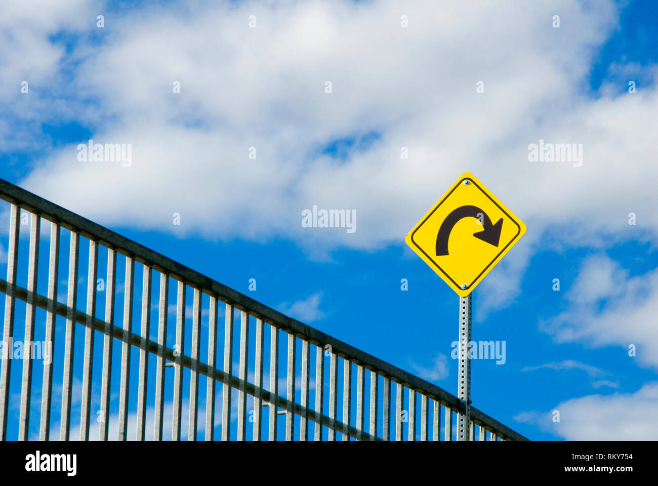 Road Sign Warning of a Turn Stock Photo - Alamy