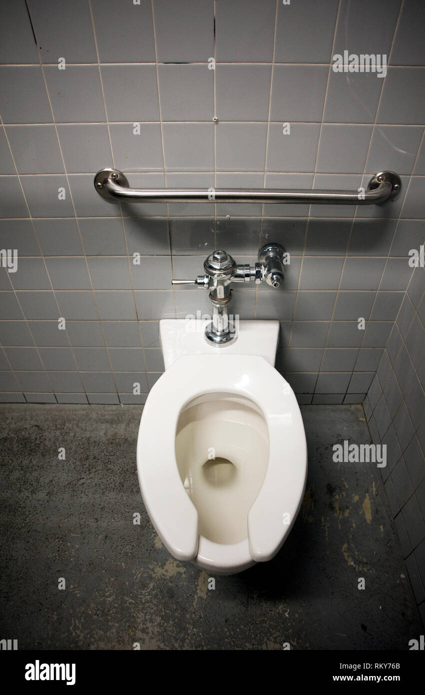 Toilet Bowl in a Tiled Restroom Stock Photo - Alamy