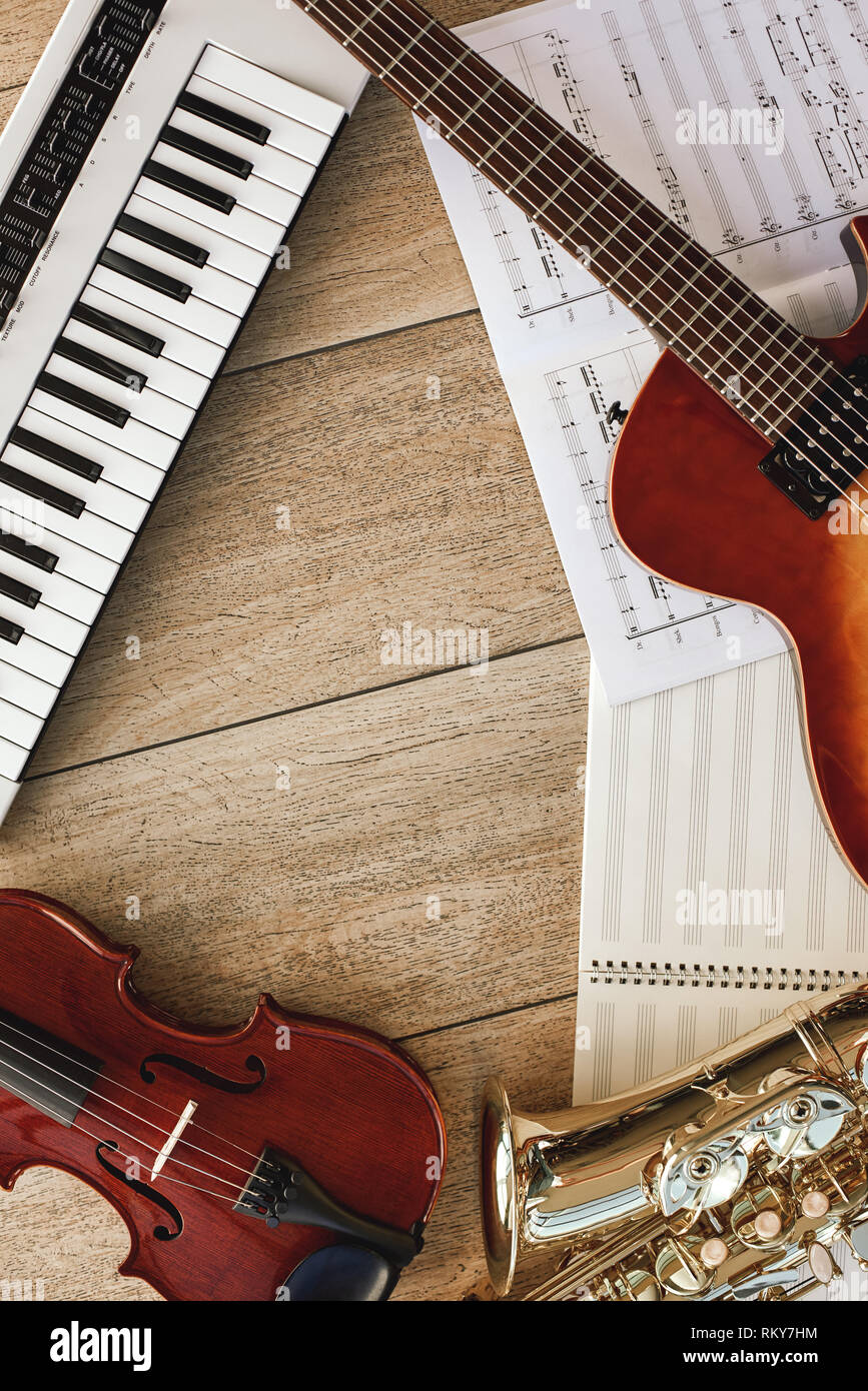 Vertical top view of different musical instruments: synthesizer, guitar ...