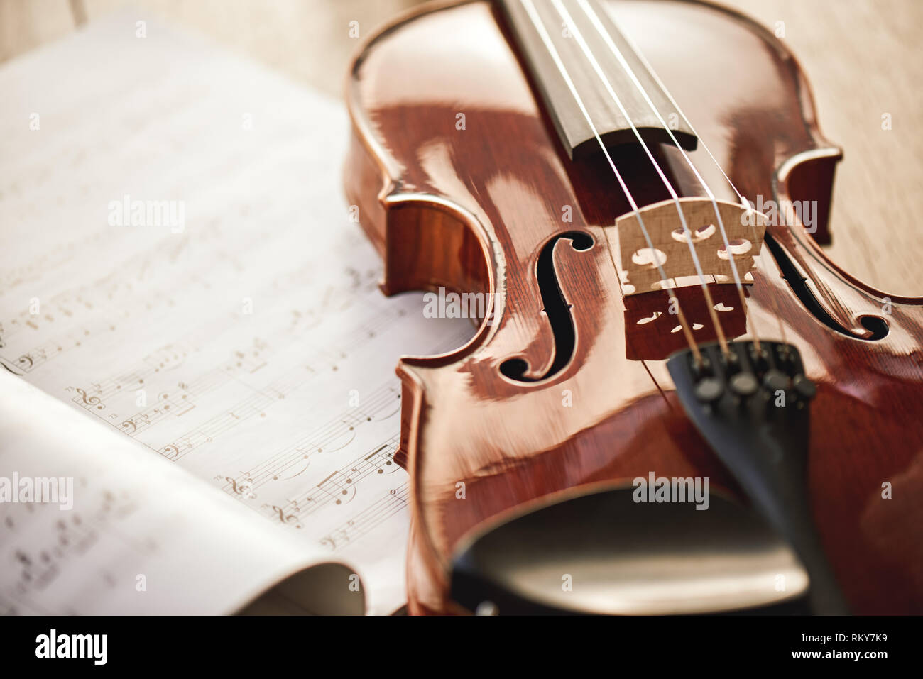 Beauty of musical instruments. Close up view of brown violin lying on ...