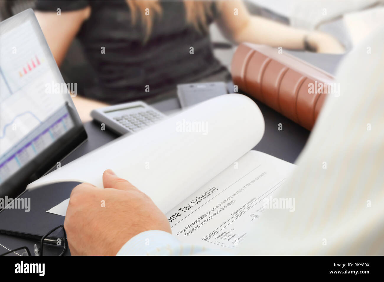 Analyzing financial documents in the office Stock Photo - Alamy