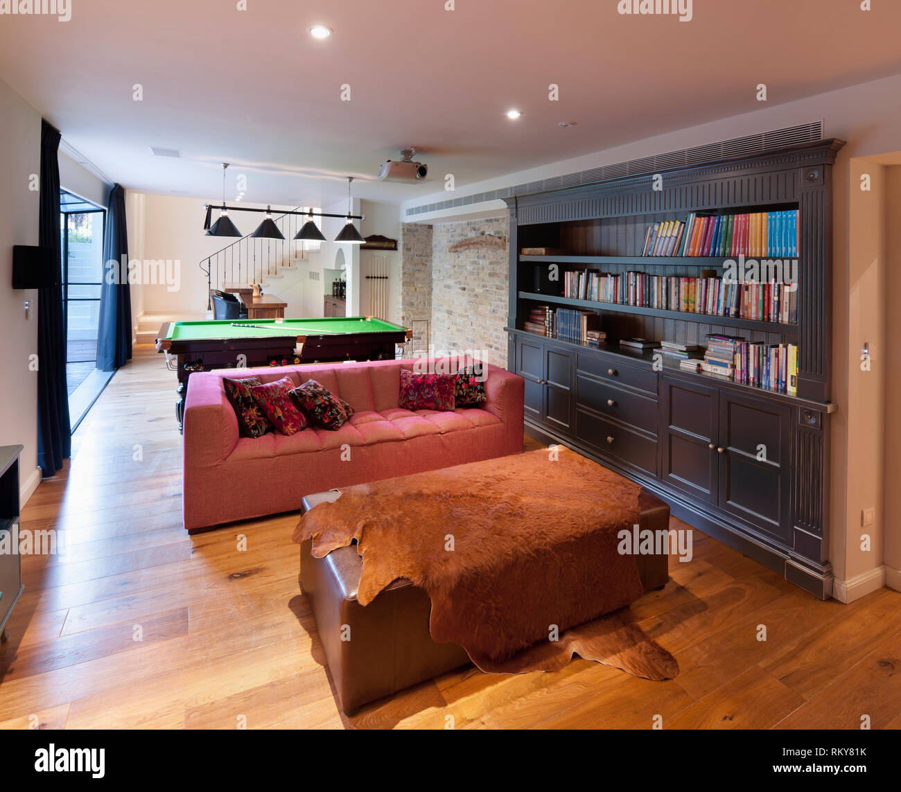 Luxury home library with pool table Stock Photo - Alamy