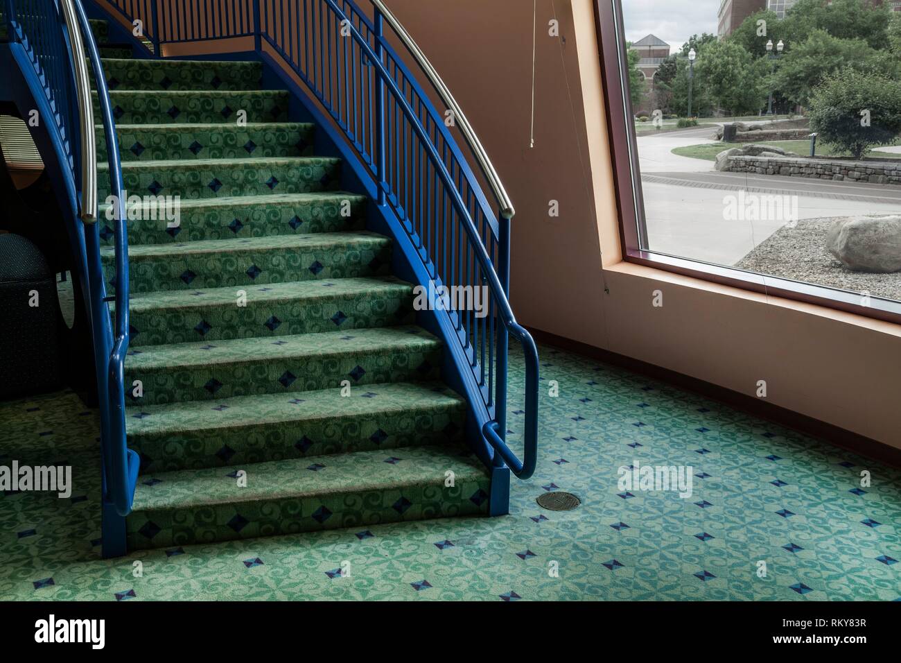 Staircase and large window in a college student lounge Stock Photo - Alamy
