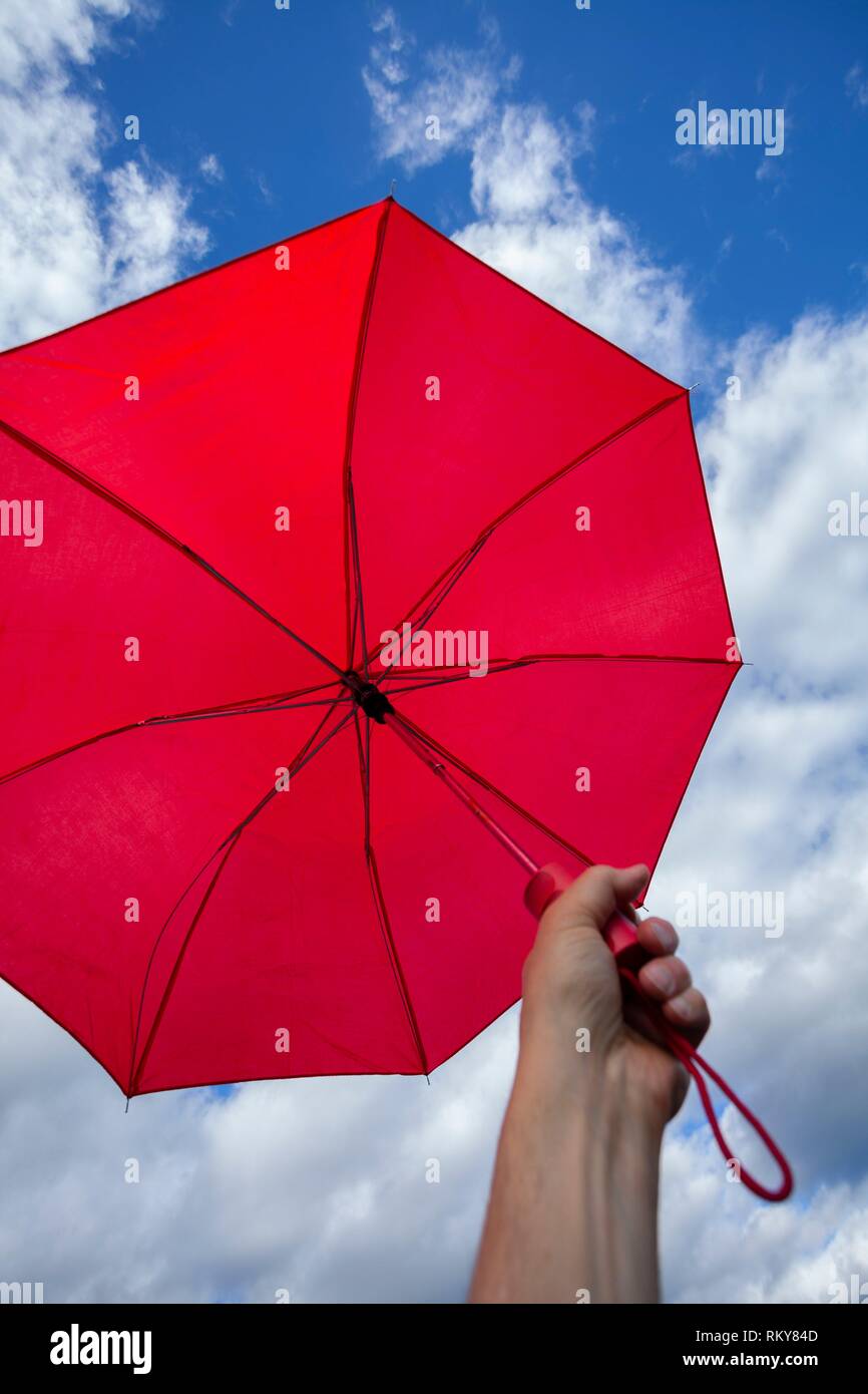 Man with red umbrella hi-res stock photography and images - Alamy