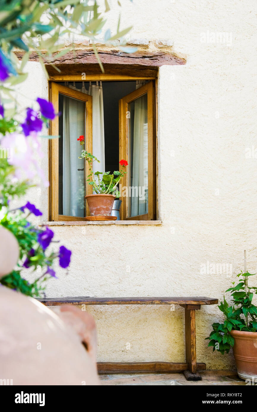 Open Window With Potted Plant and Bench Stock Photo - Alamy