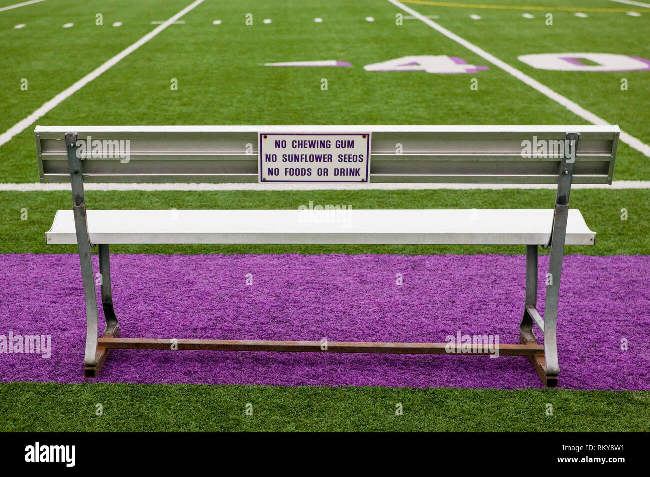 Sign on Athletic Field Bench Stock Photo - Alamy