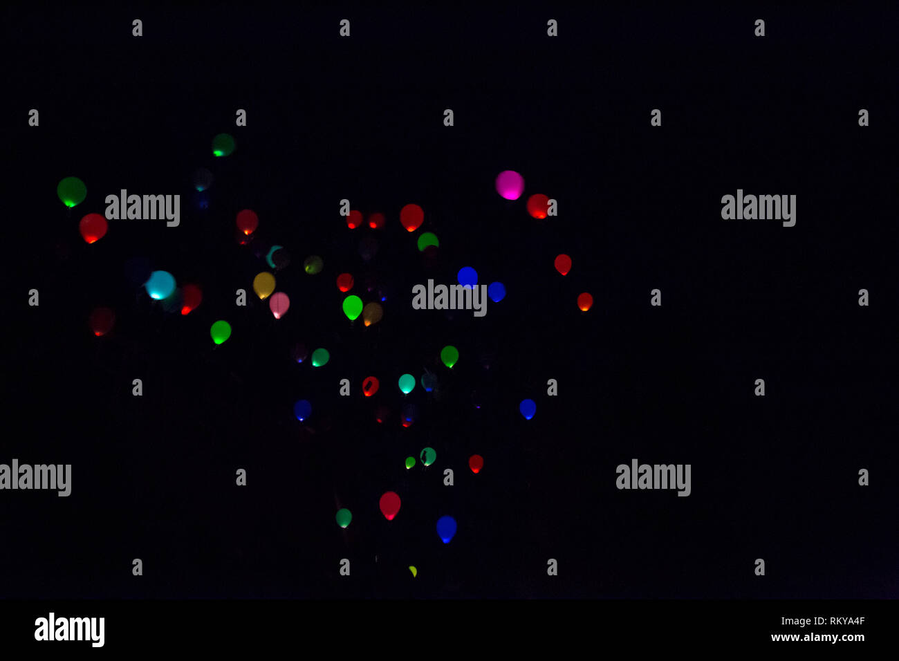 Colorful, glowing Balloons Flying in the Dark Night Sky Stock Photo - Alamy