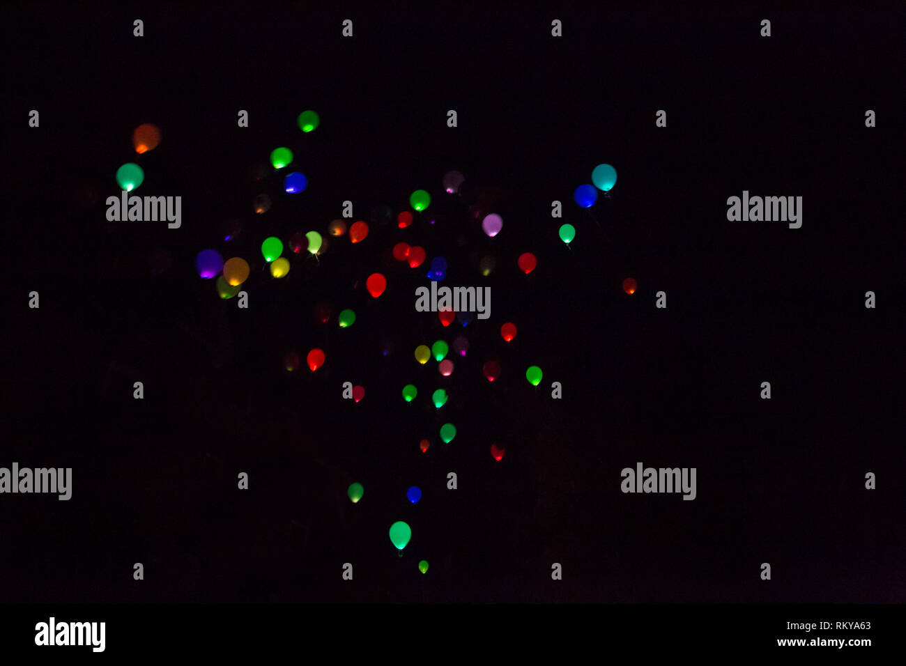 Colorful, glowing Balloons Flying in the Dark Night Sky Stock Photo - Alamy